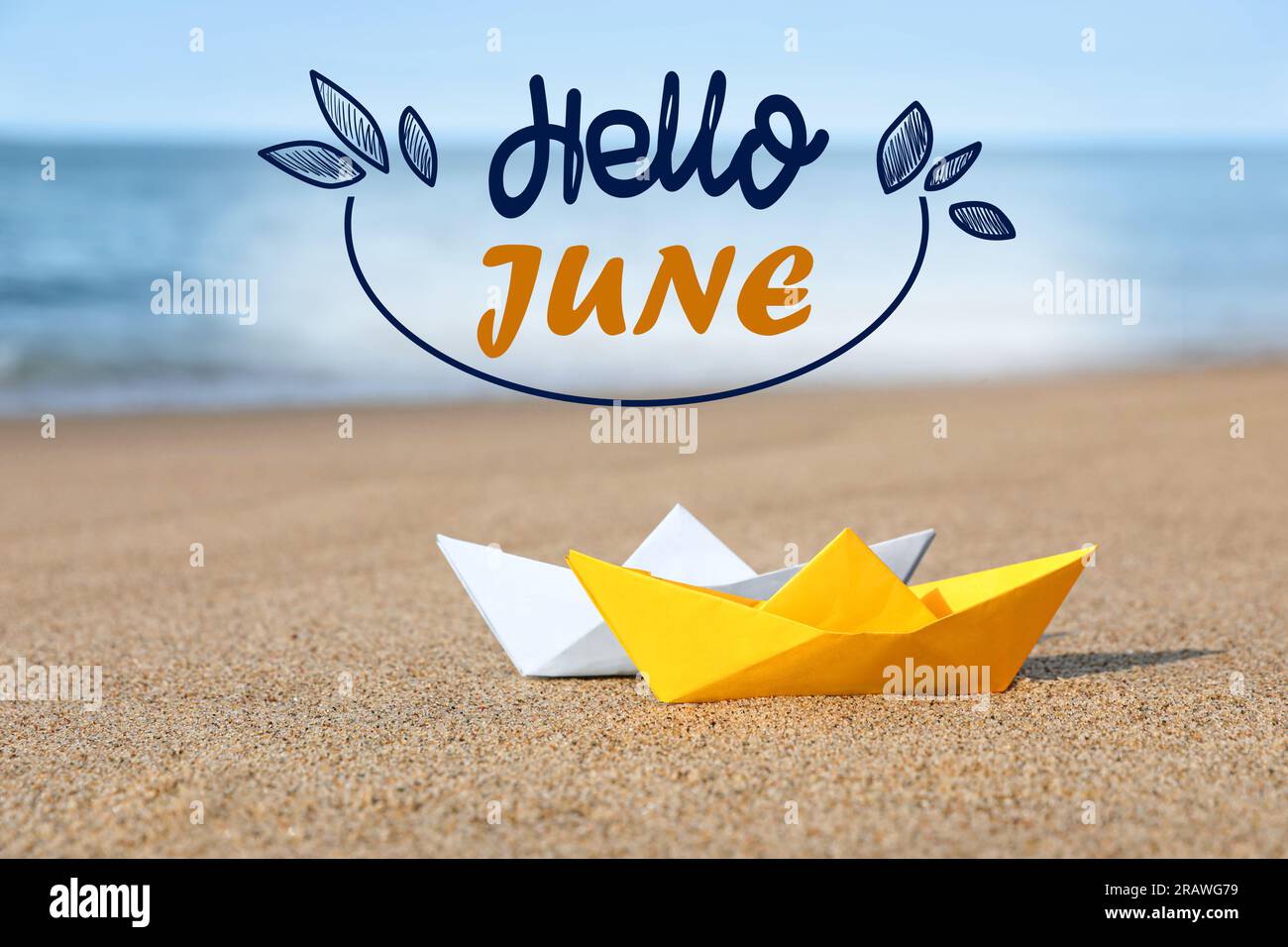 Hello June. Color paper boats on sandy beach near sea Stock Photo - Alamy