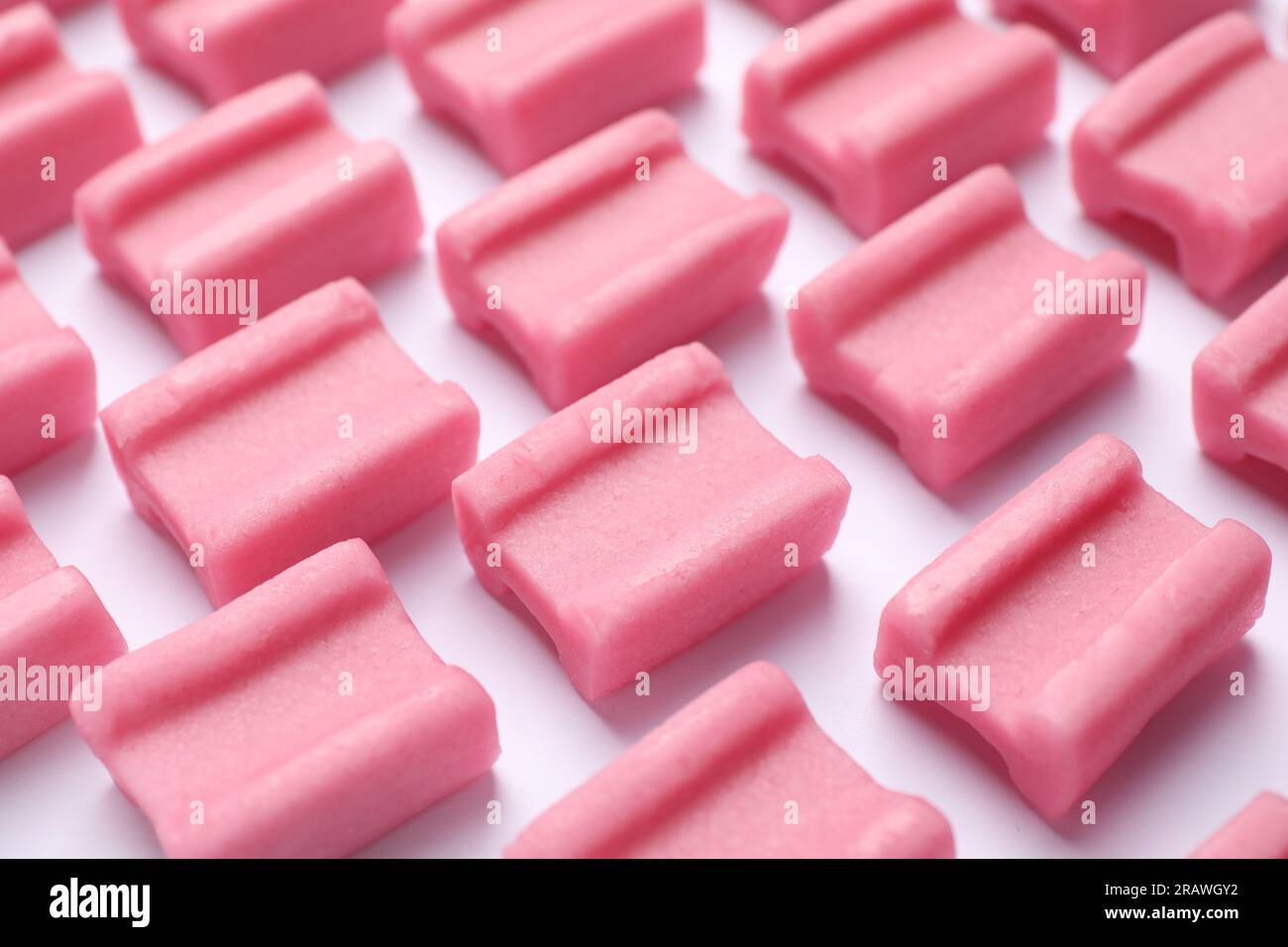 Tasty pink chewing gums on white background, closeup Stock Photo - Alamy