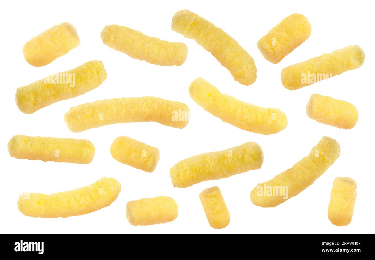 Many tasty corn sticks falling on white background Stock Photo - Alamy