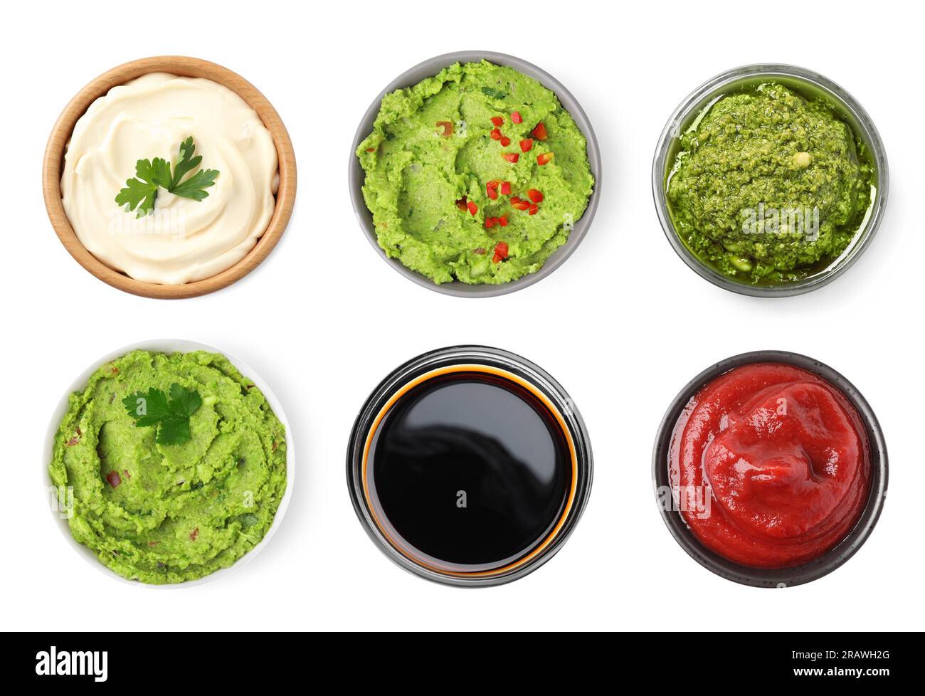 Set of guacamole and different sauces on white background, top view ...