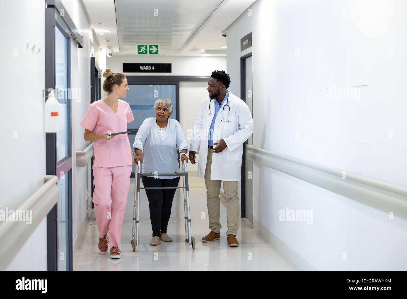 Diverse doctors and senior female patient with walking frame, walking ...