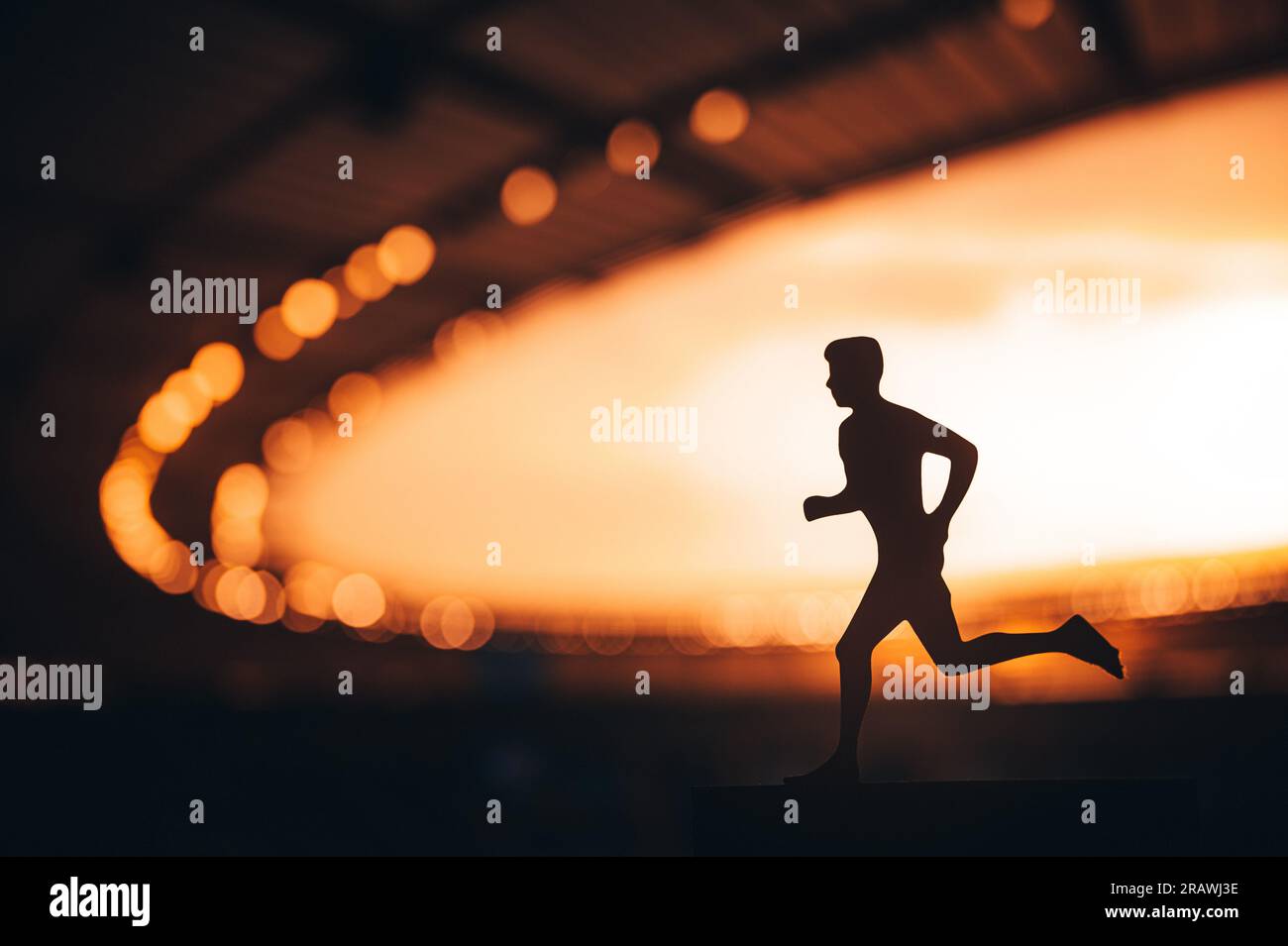 Silhouette of a Male Athlete, an Endurance Runner, Emerges Strong ...