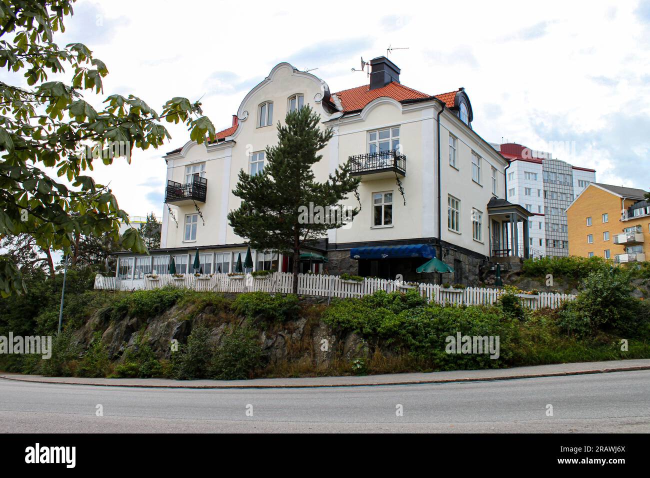 a house on the side of a road Stock Photo - Alamy