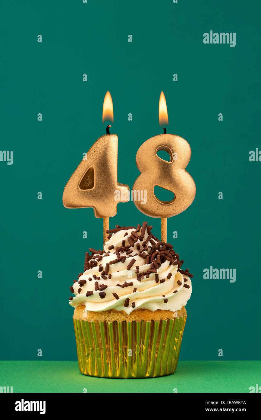 Birthday card with candle number 48 - Green background Stock Photo - Alamy