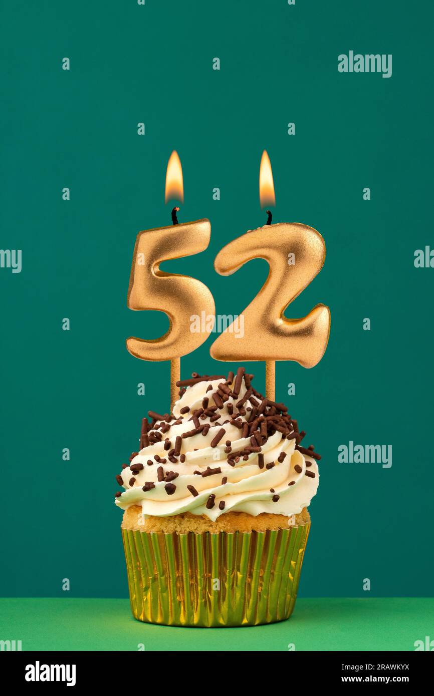 Birthday card with candle number 52 - Green background Stock Photo - Alamy