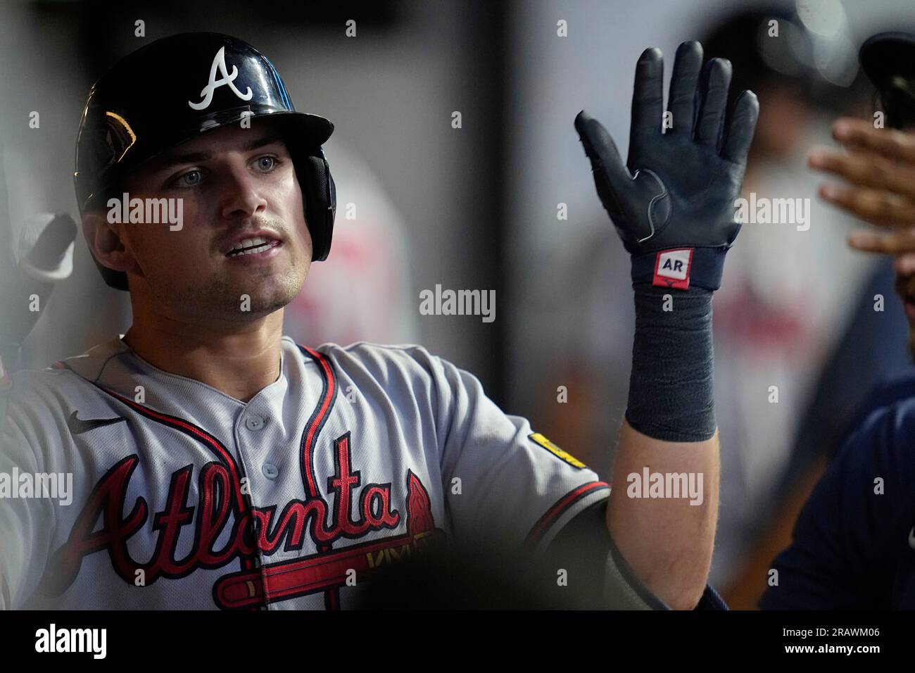 Atlanta Braves' Austin Riley gets high-fives in the dugout after his ...