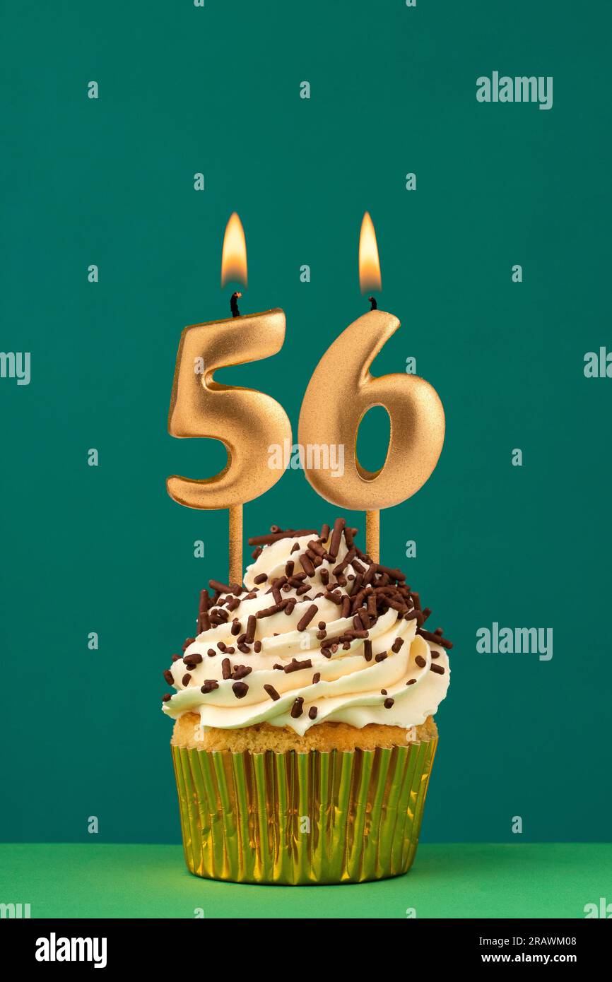 Birthday card with candle number 56 - Green background Stock Photo - Alamy