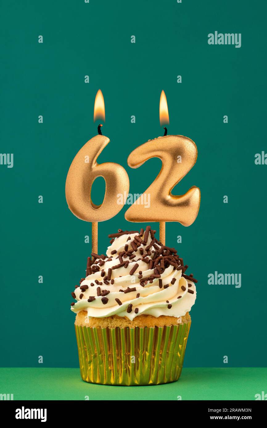 Birthday card with candle number 62 - Green background Stock Photo - Alamy