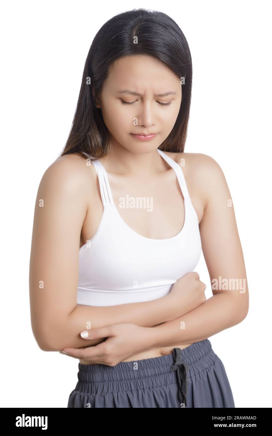 Asian woman suffering from a stomach ache isolated on a white ...