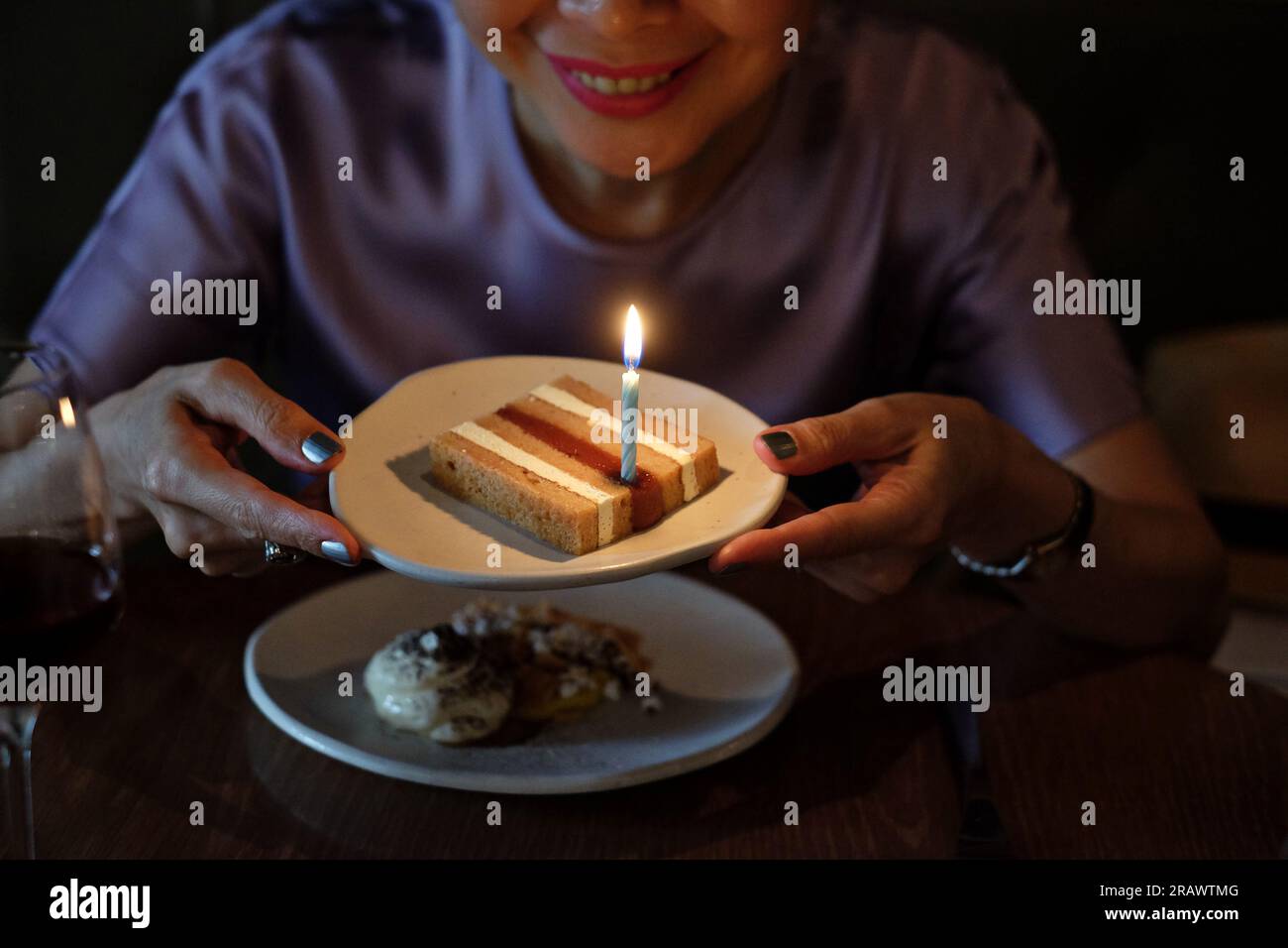 Slice of cake with candle, birthday celebration lunch At Yellow Vegan ...