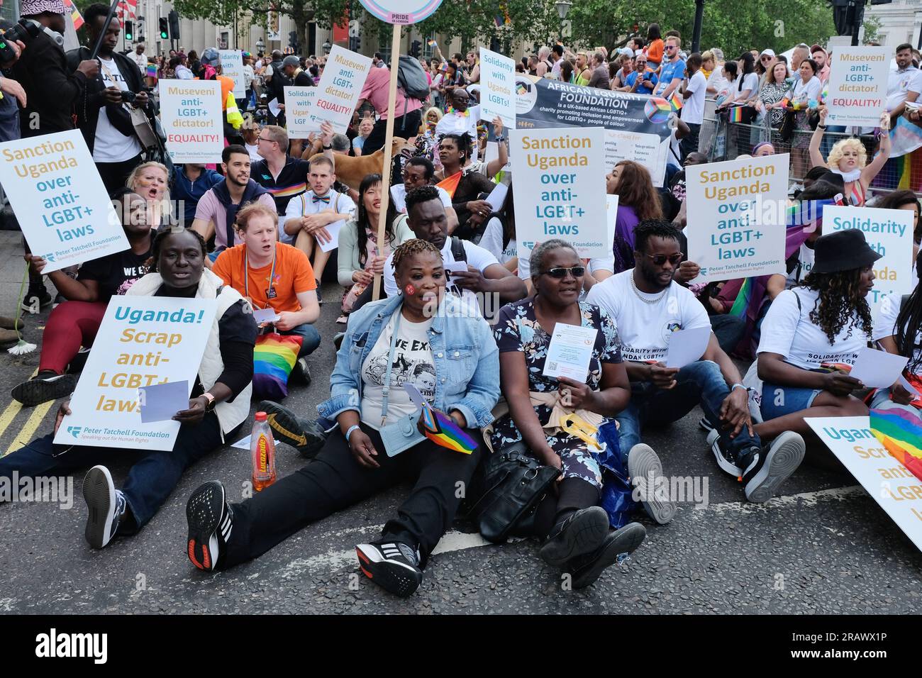 London, UK. Marchers in the Pride in London parade take part in a sit ...