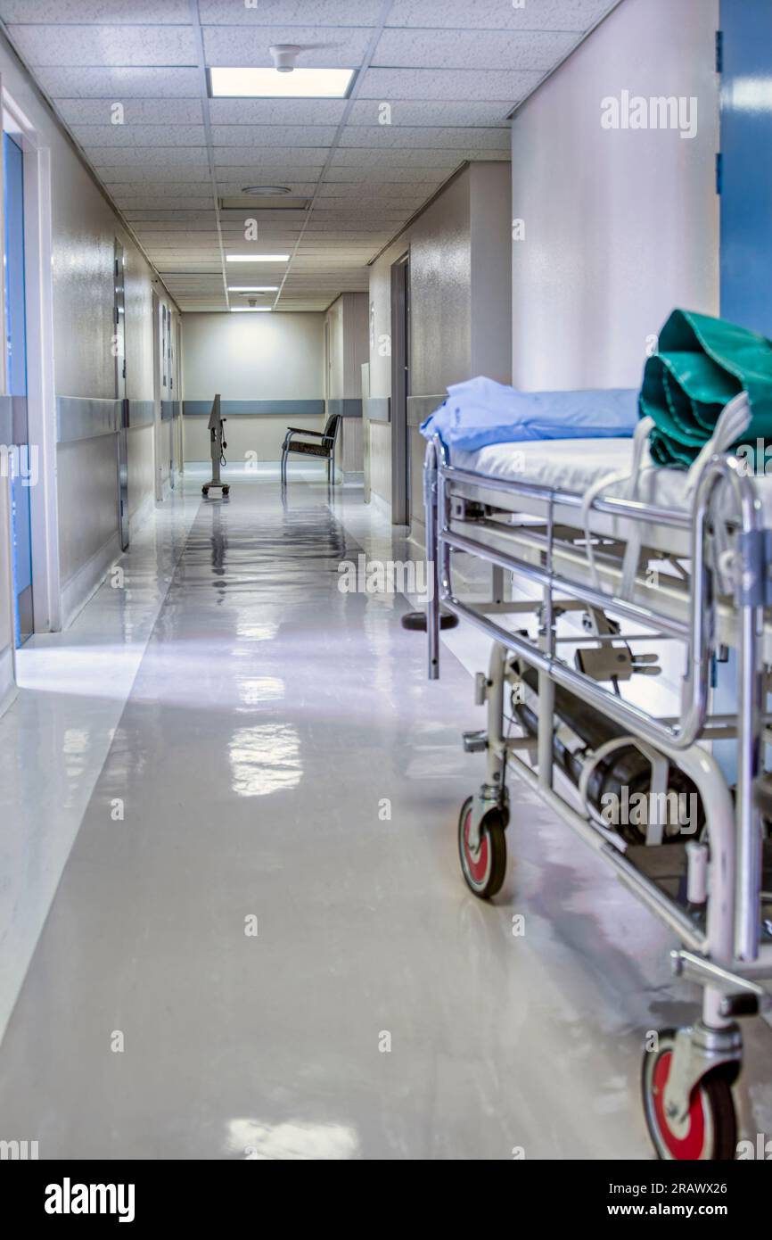 hospital bed in a long hallway, medical care Stock Photo - Alamy