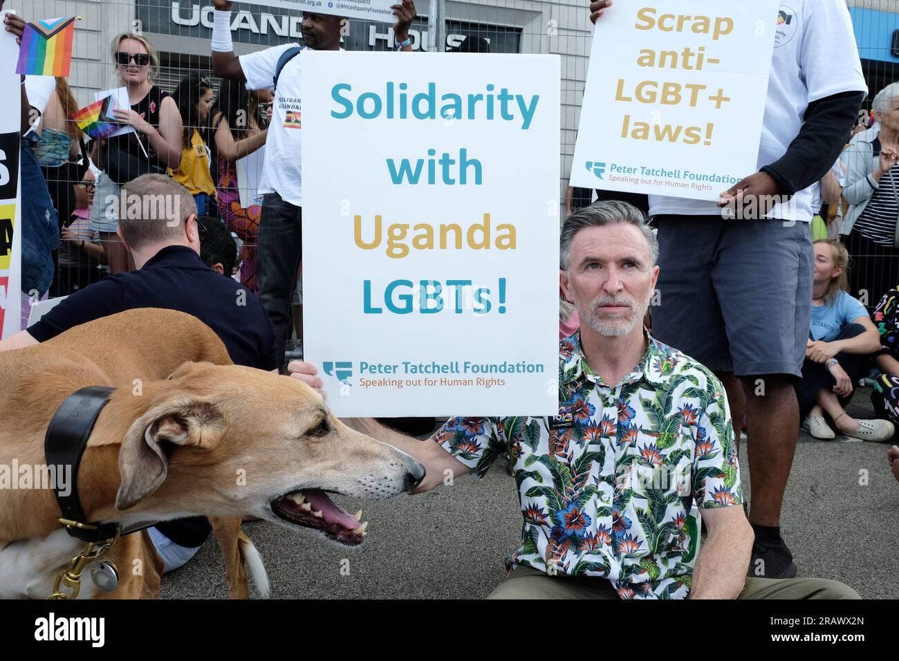 London, UK. Marchers in the Pride in London parade take part in a sit ...