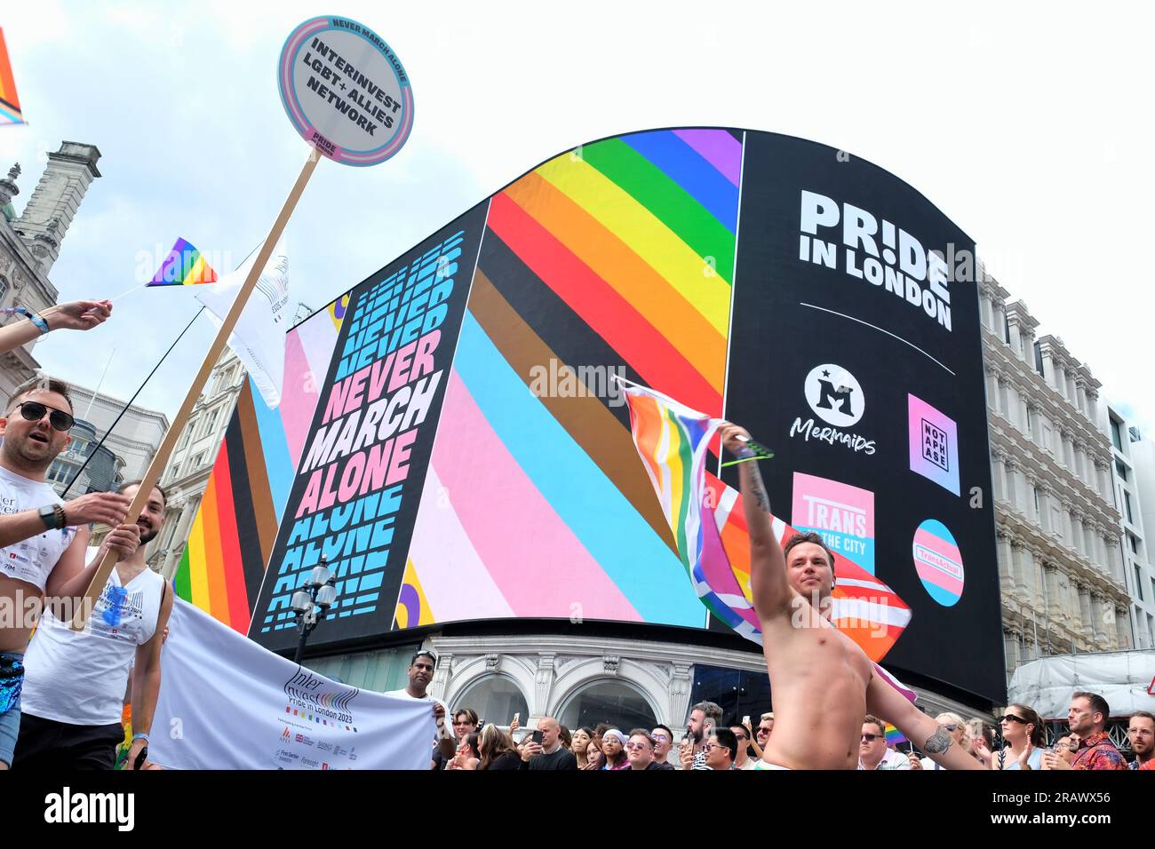 London, UK. Participants in the Pride in London parade pass the ...