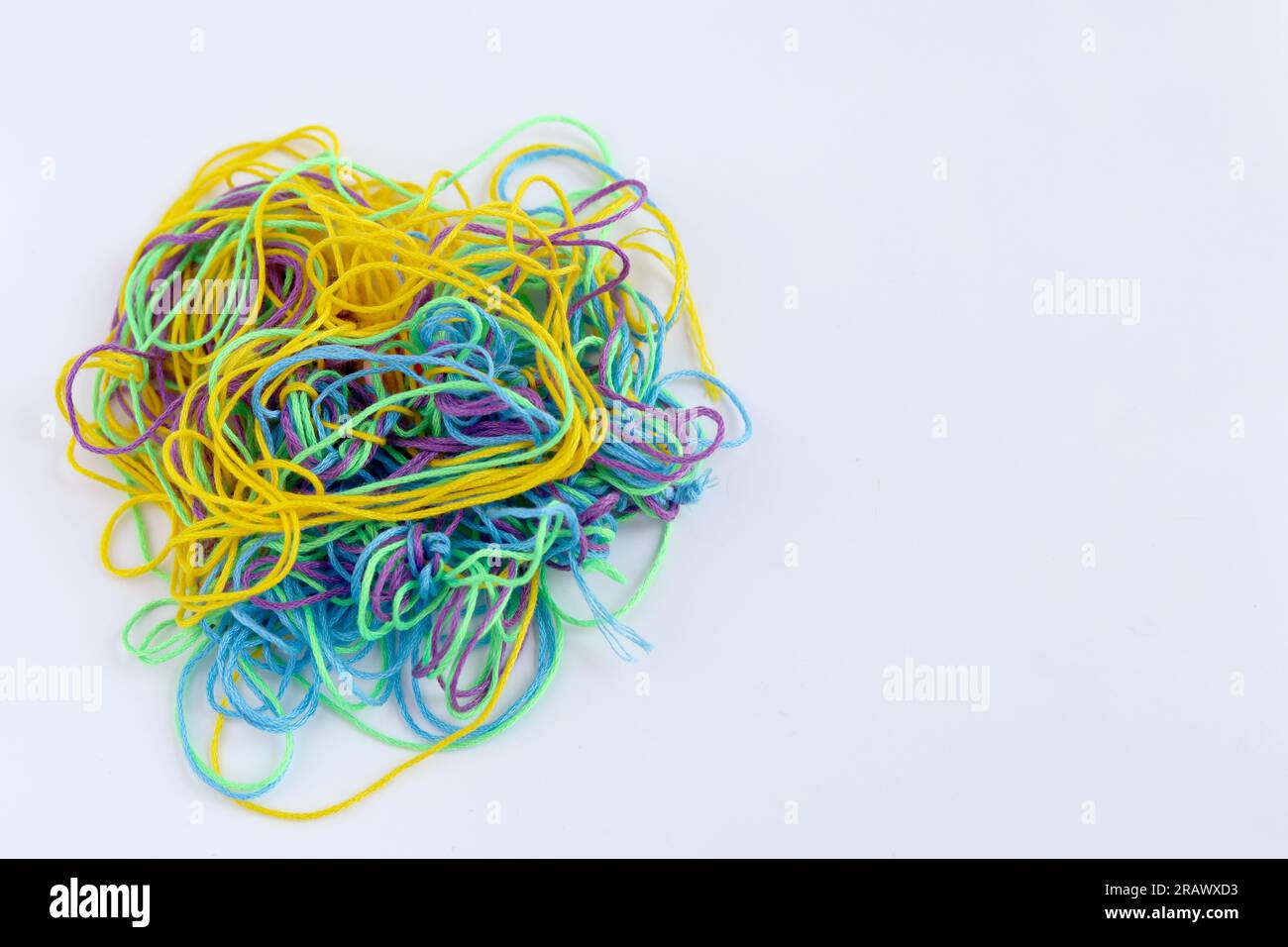 multi color tangled thread isolated on white background Stock Photo - Alamy