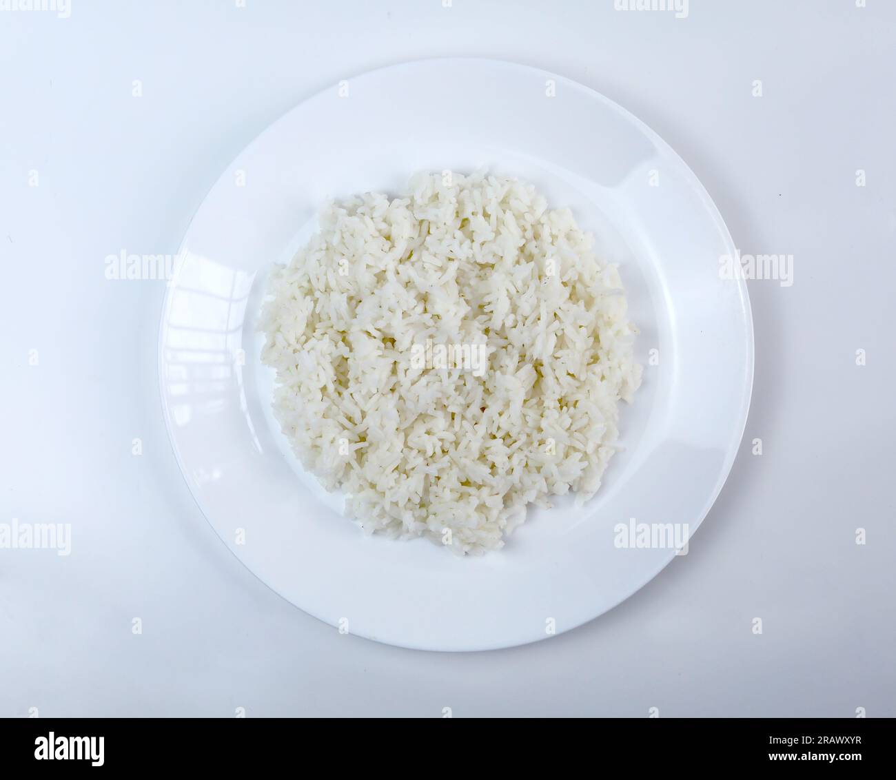 Cooked white rice on a plate and isolated on white background Stock ...