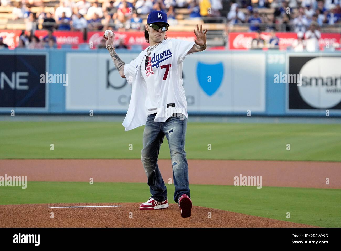 Rapper Peso Pluma throws out the ceremonial first pitch prior to a ...