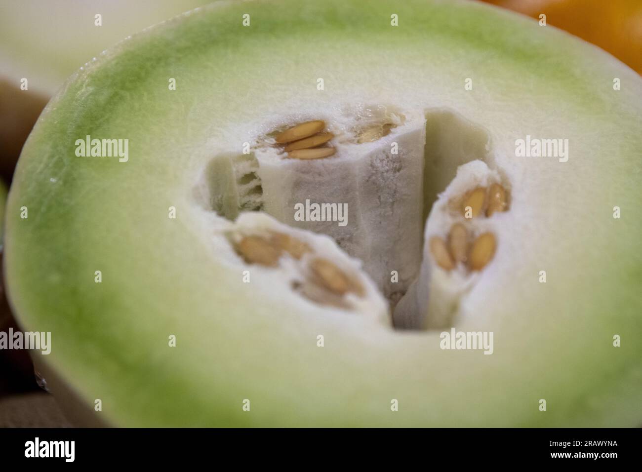 Honeydew Melon cut in half showing the core Stock Photo - Alamy