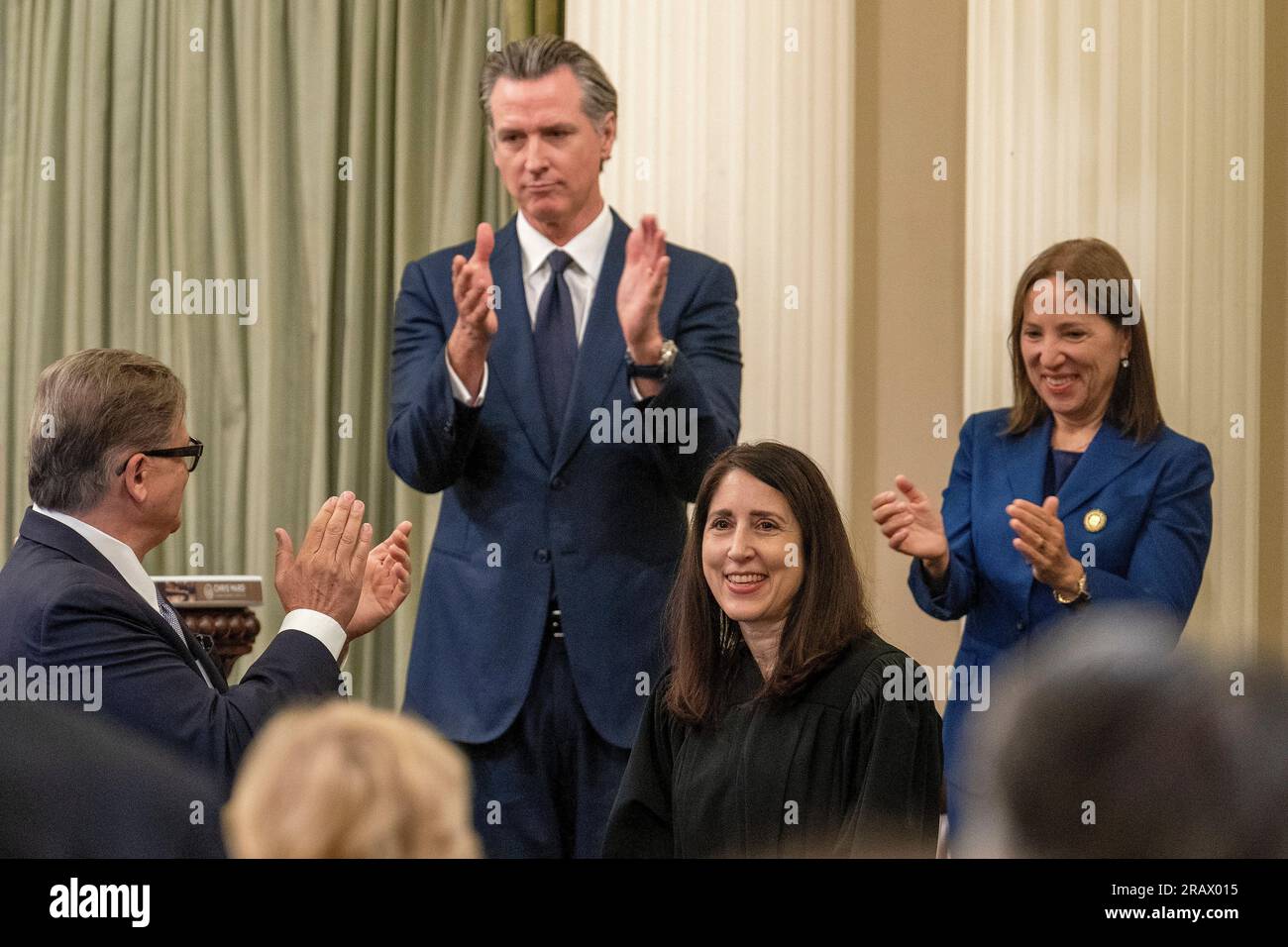California Supreme Court Chief Justice Patricia Guerrero, third from ...