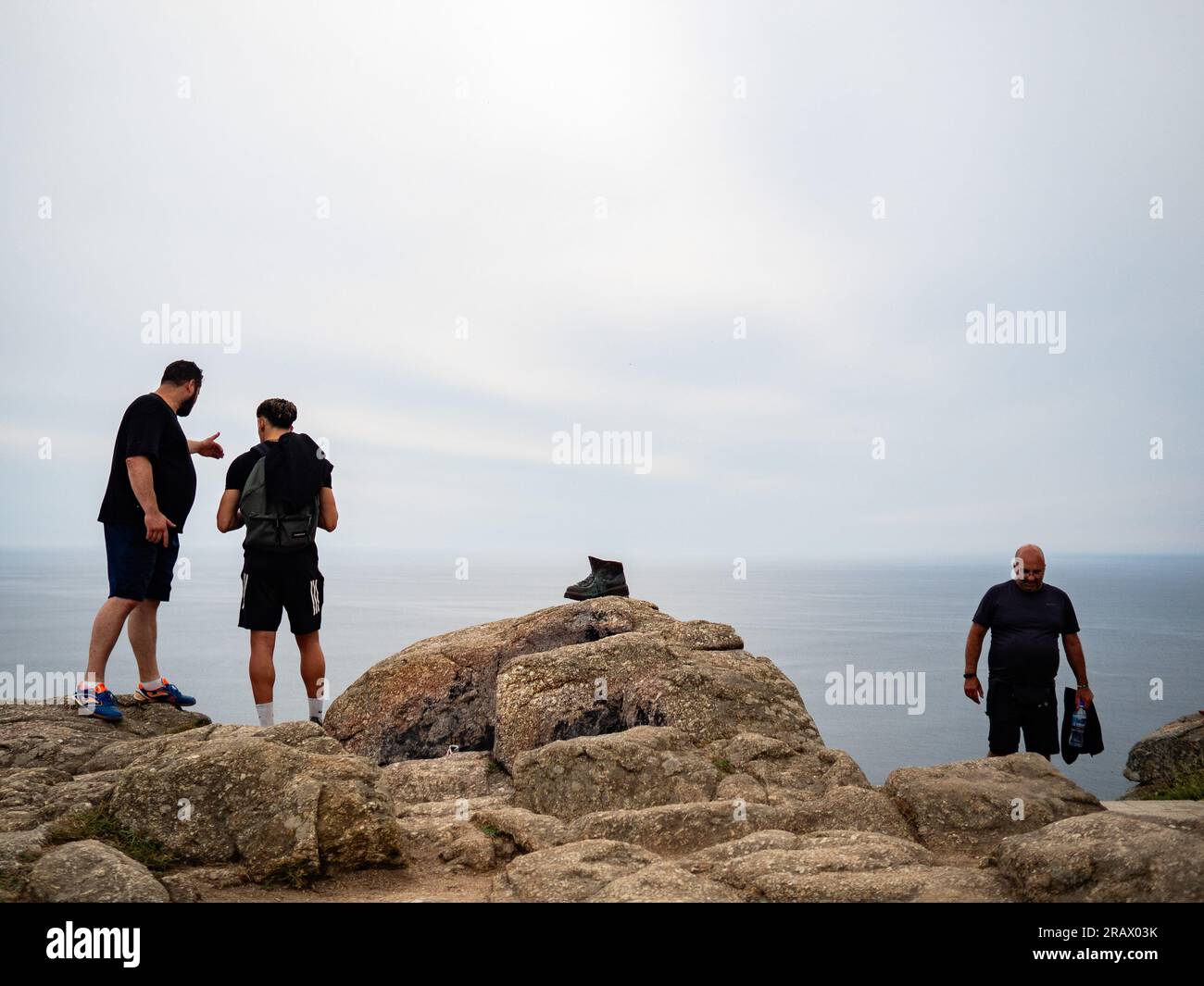 People are seen taking photos next to the famous pilgrim boot. The ...