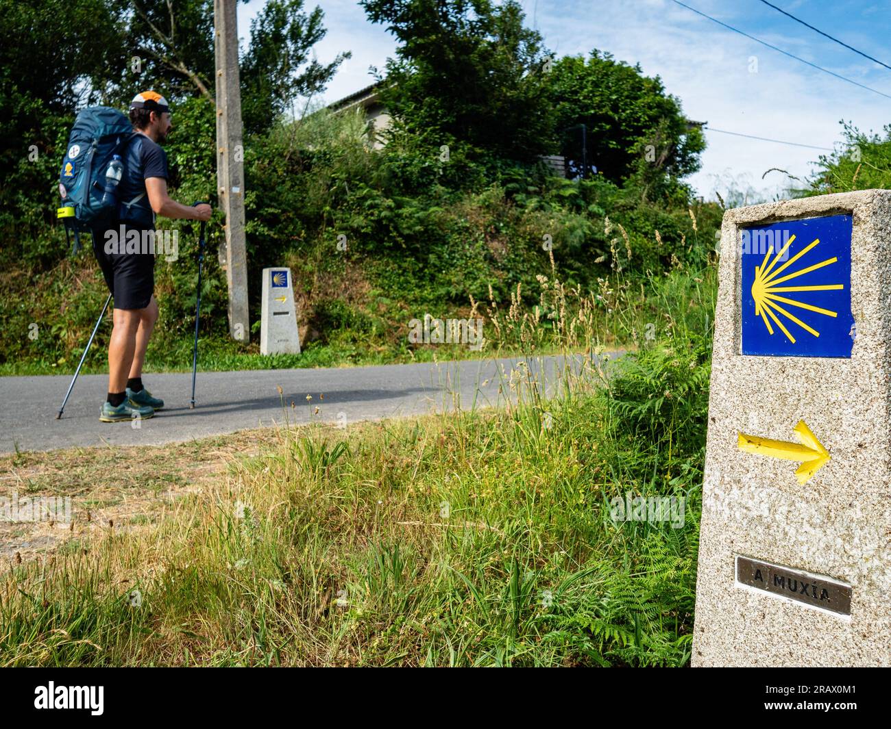 June 6, 2023, Finisterre, Spain: A pilgrim is seen following the yellow ...