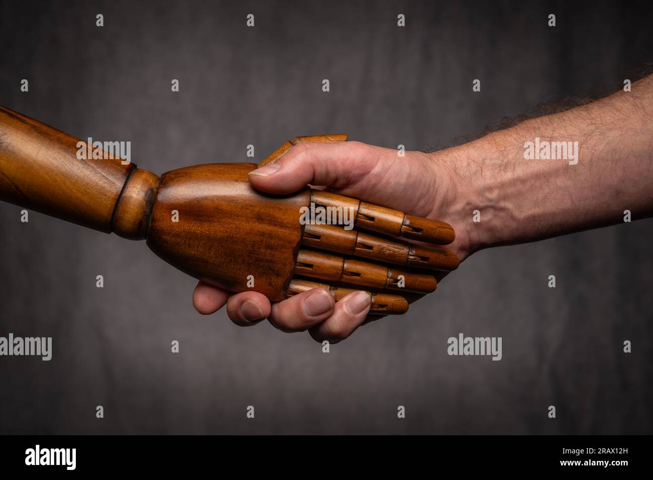 Close up of the wooden dressmakers mannequin retro style hand shaking ...