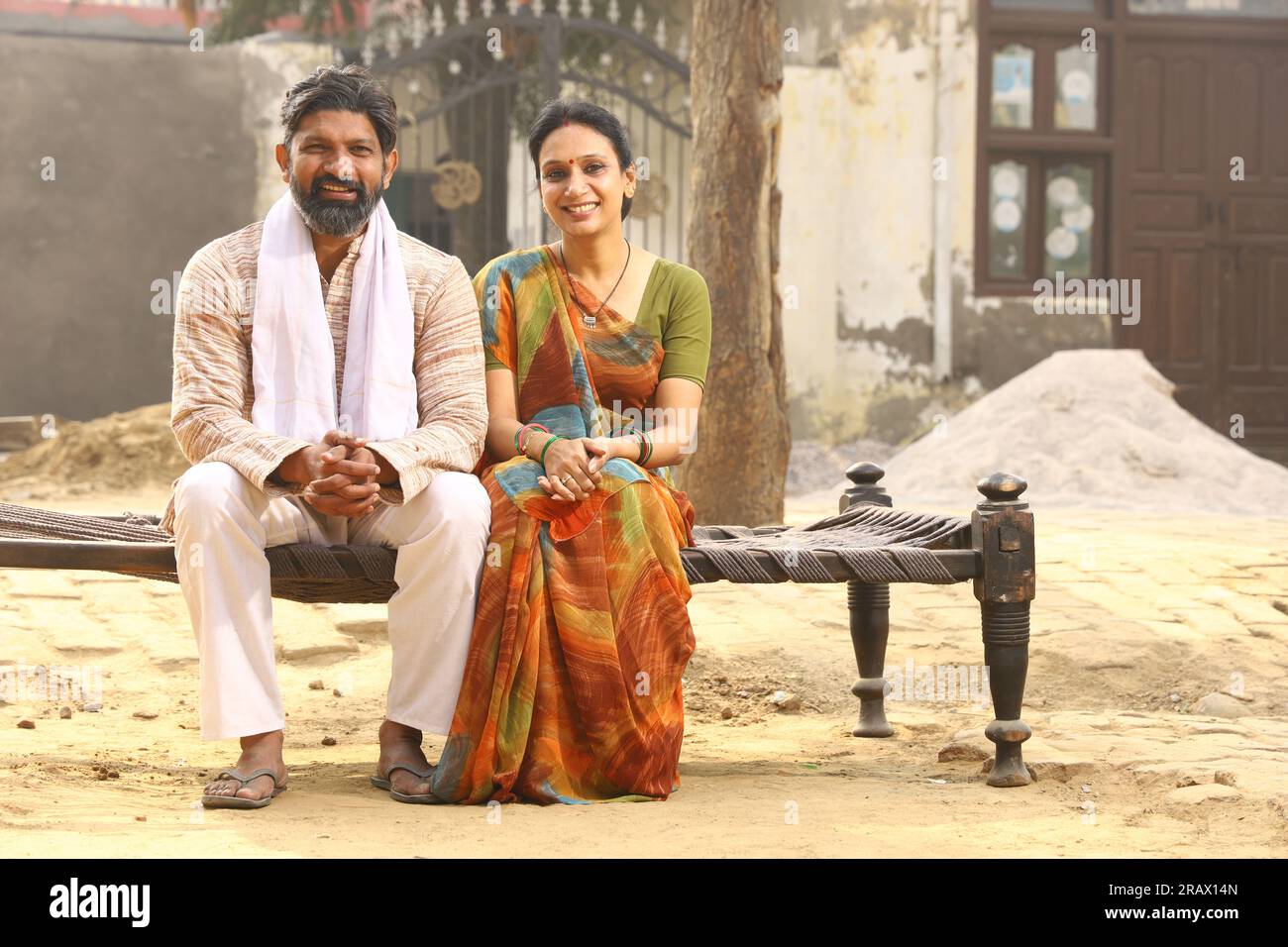 Aged man sitting in Rural Environment wearing kurta-pajama which is ...