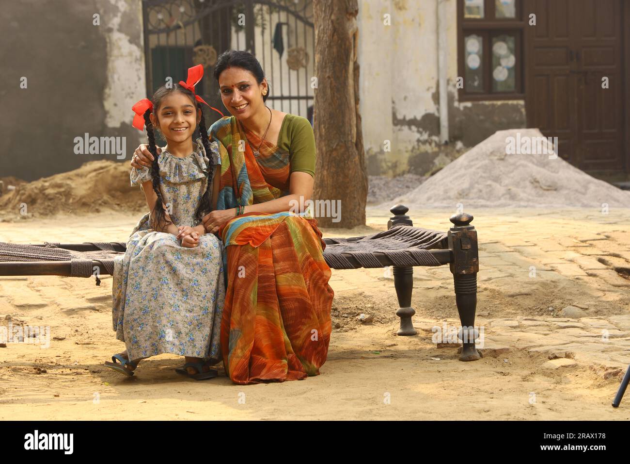 Happy Indian Rural family in village. Mother and daughters sitting ...
