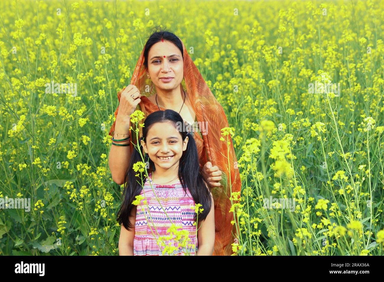 Happy Indian Rural family in village. Mother and daughters sitting ...