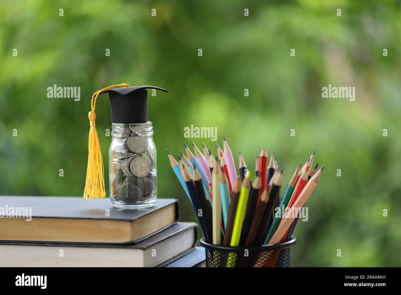 Knowledge and Success: Graduation Cap on Books Against a Beautiful ...