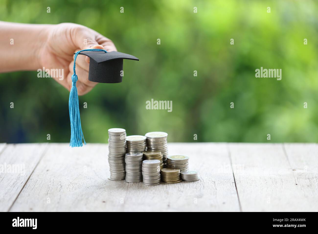 Knowledge and Success: Graduation Cap on Books Against a Beautiful ...