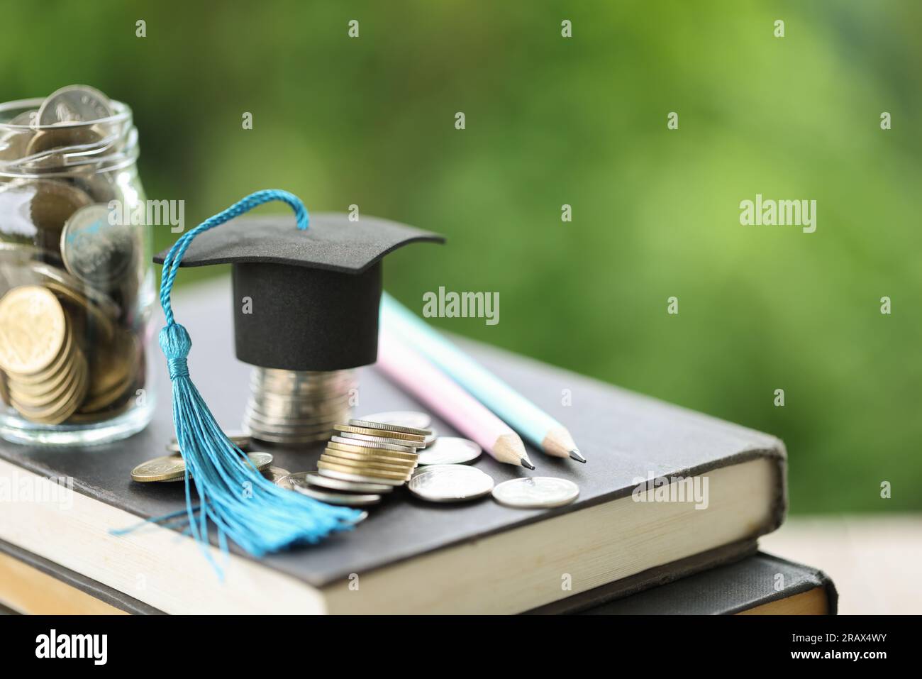 Knowledge and Success: Graduation Cap on Books Against a Beautiful ...