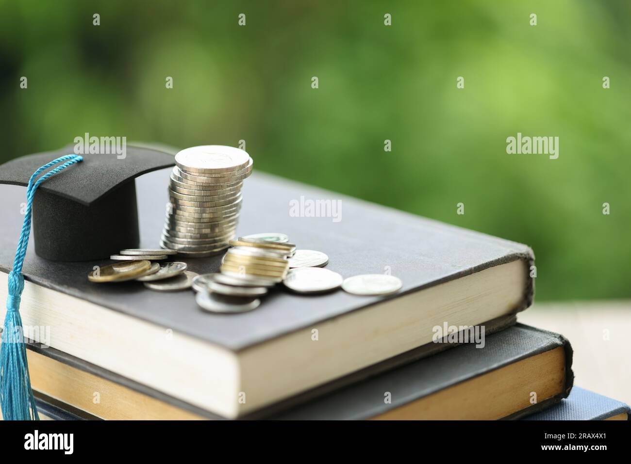 Knowledge and Success: Graduation Cap on Books Against a Beautiful ...