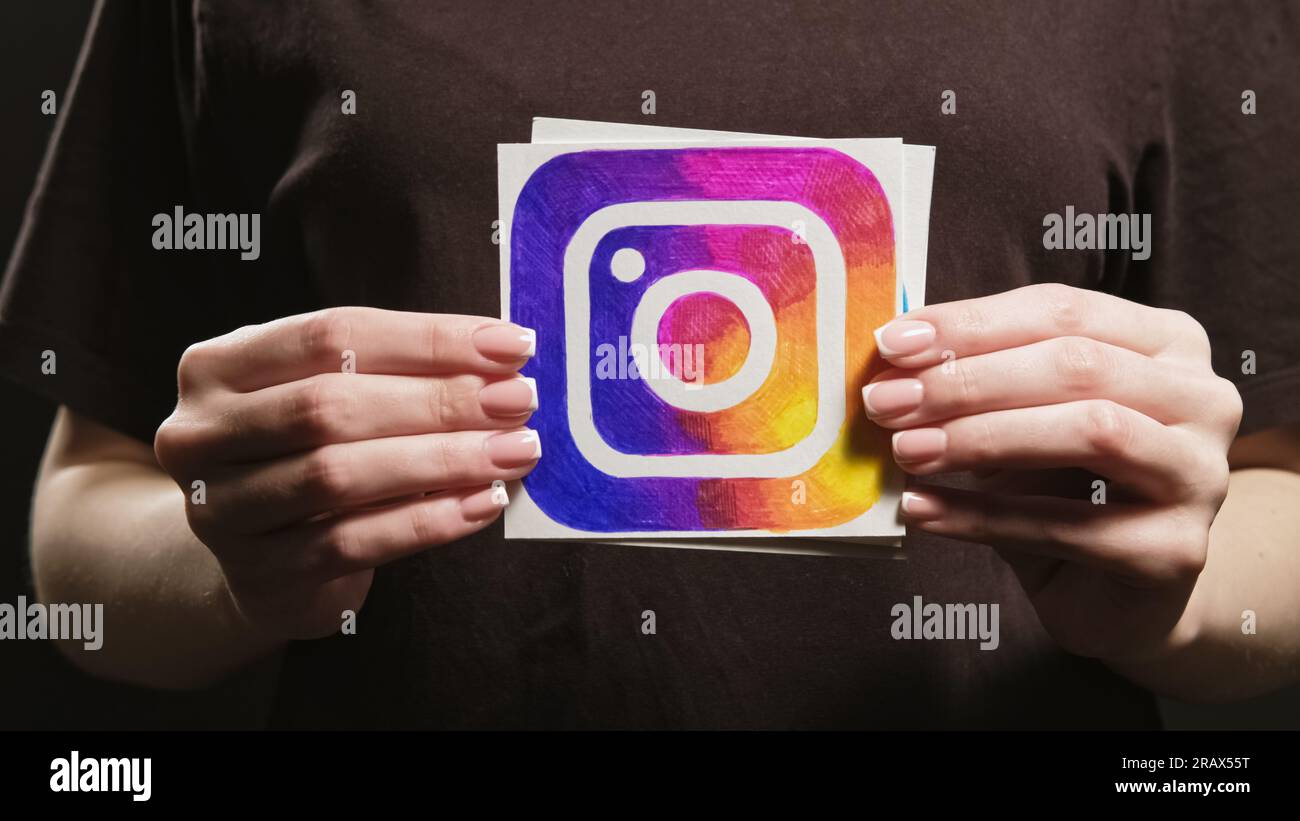 Instagram icon social media promotion hands logo Stock Photo - Alamy