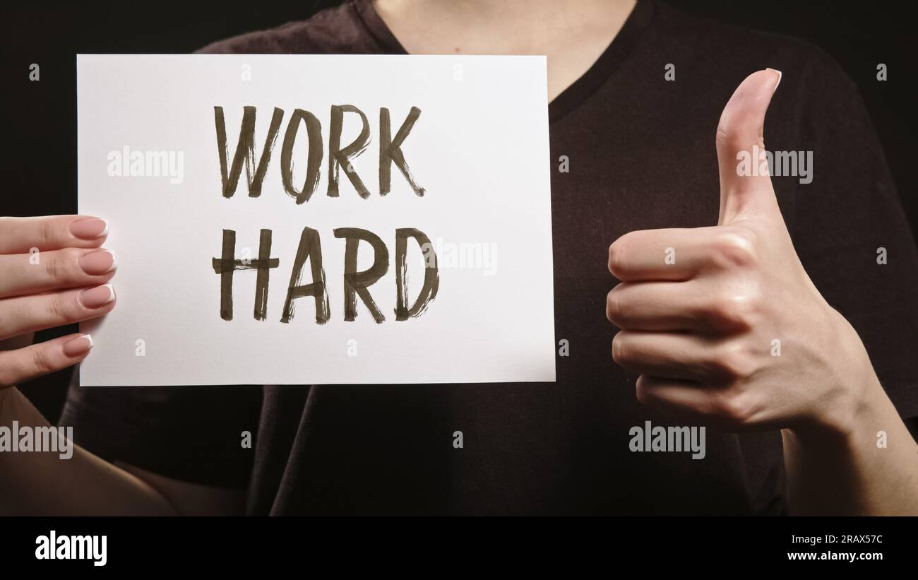 Work hard phrase ambition encouragement thumb up Stock Photo - Alamy