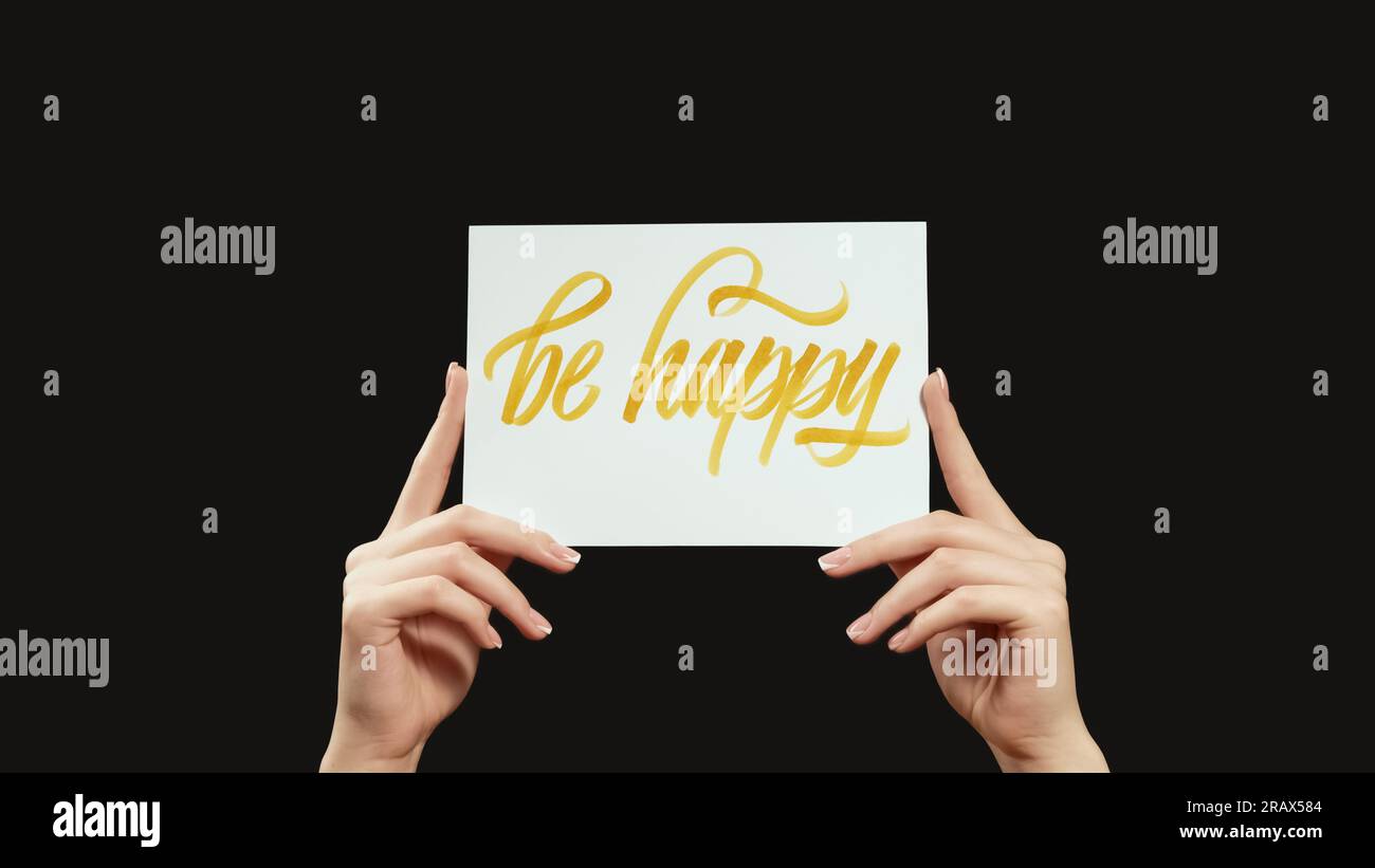 Be happy motivation slogan hands encouraging text Stock Photo - Alamy