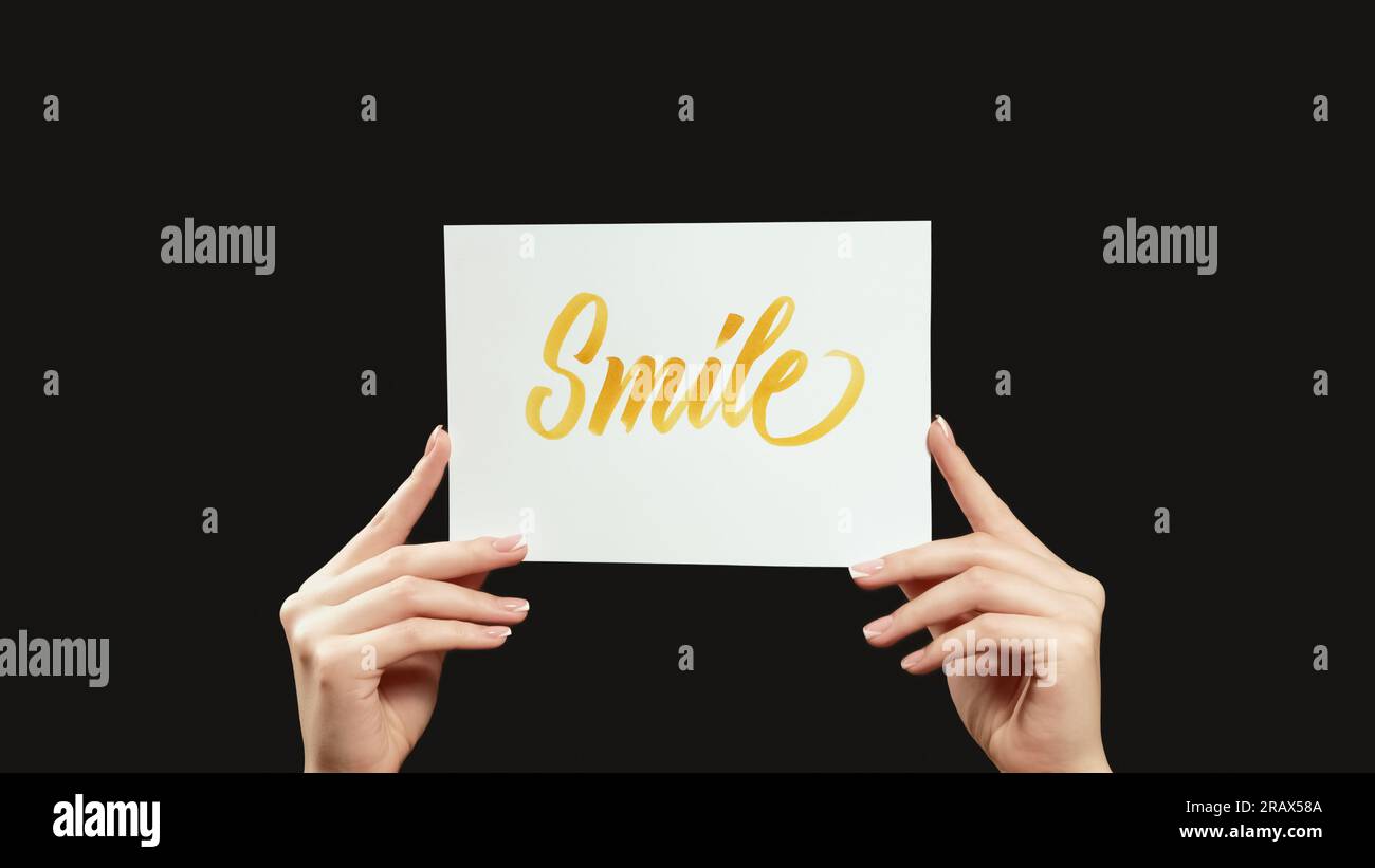 Smile sign positive motivation hands text placard Stock Photo - Alamy