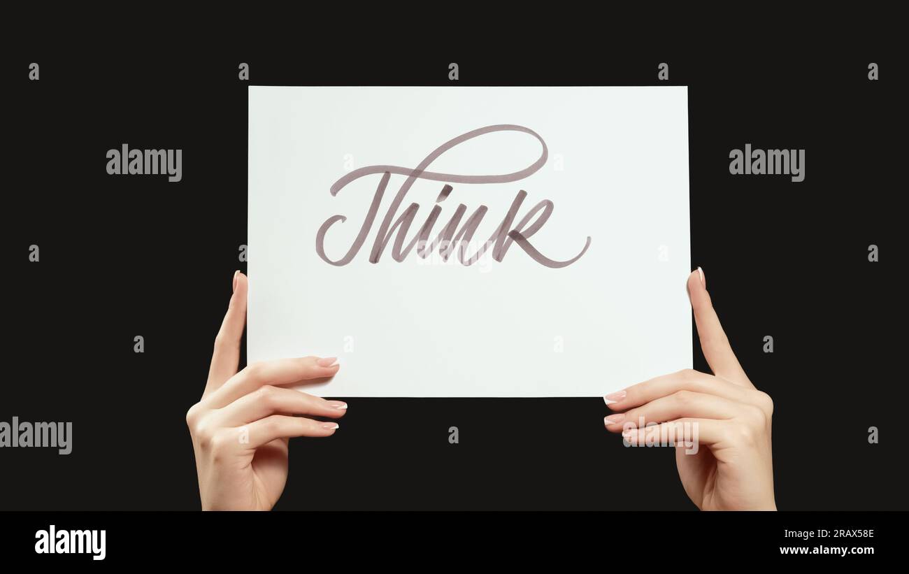 Think lettering idea motivation hands placard dark Stock Photo - Alamy