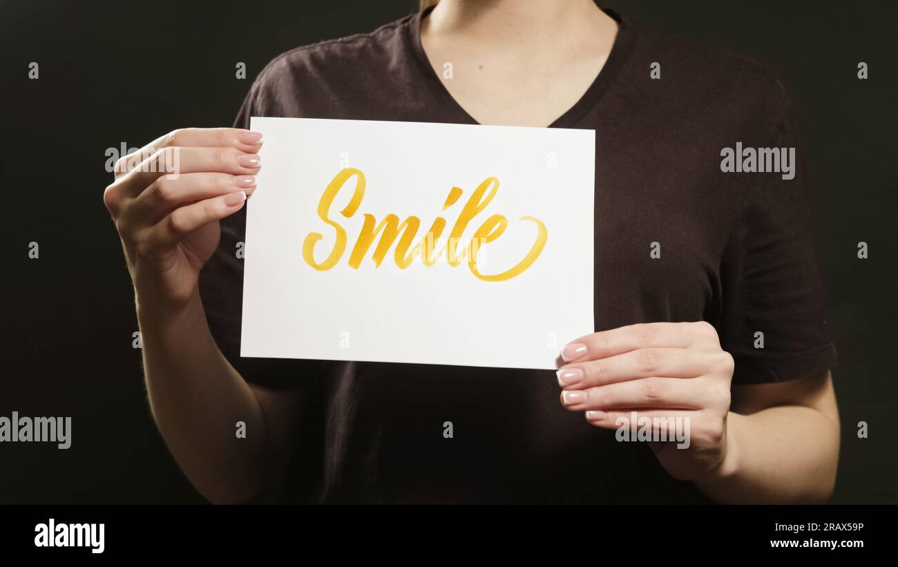 Smile word happiness motivation kind message hands Stock Photo - Alamy