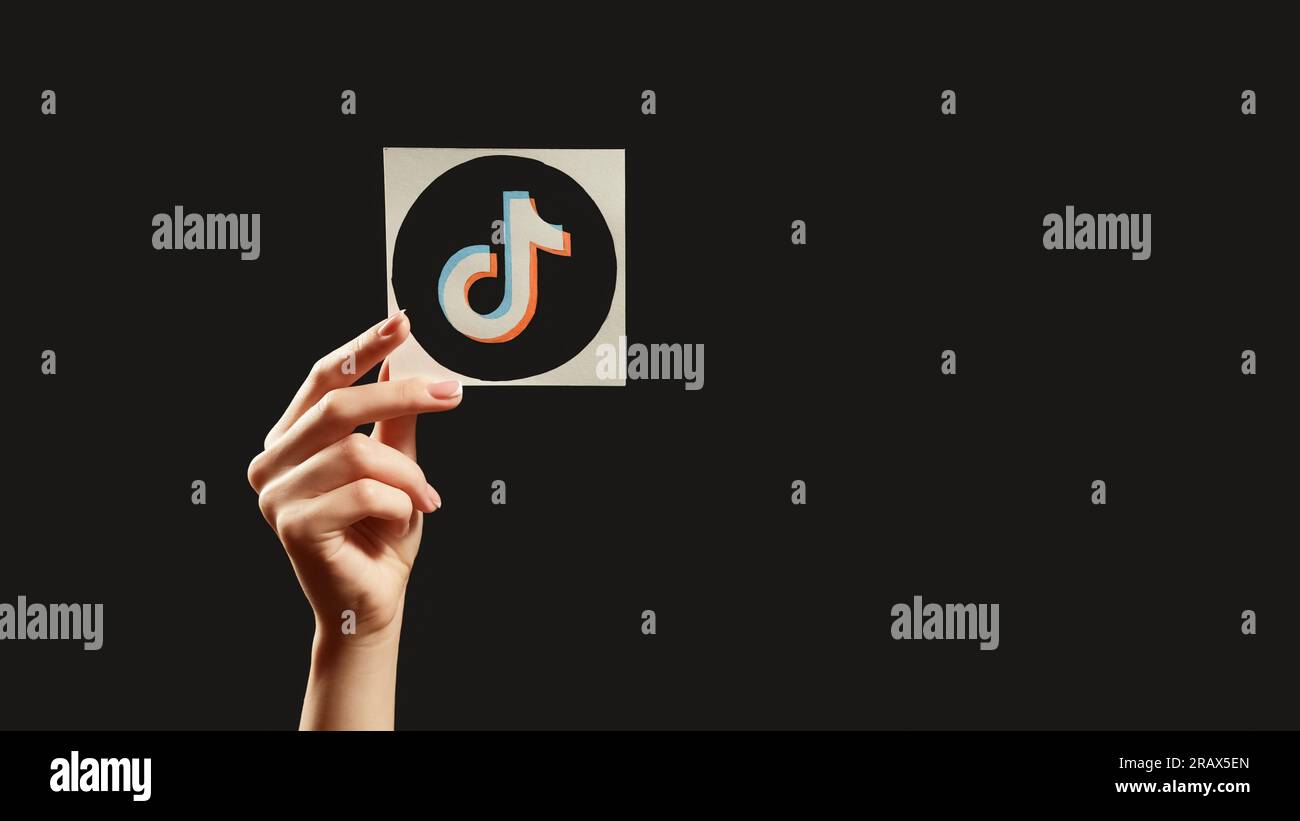 Follow tiktok social network service hand app logo Stock Photo - Alamy