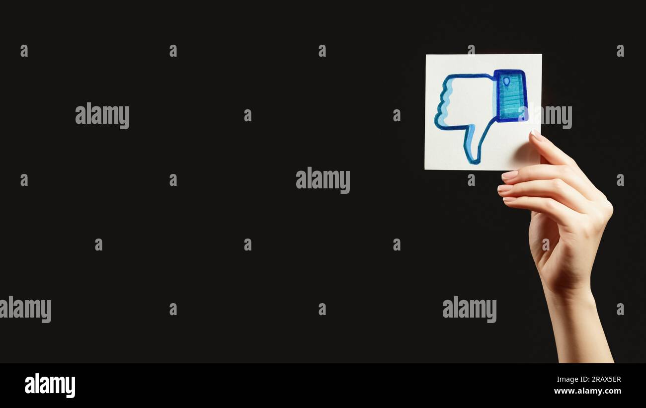 Facebook dislike unfollow hand thumb down sign Stock Photo - Alamy