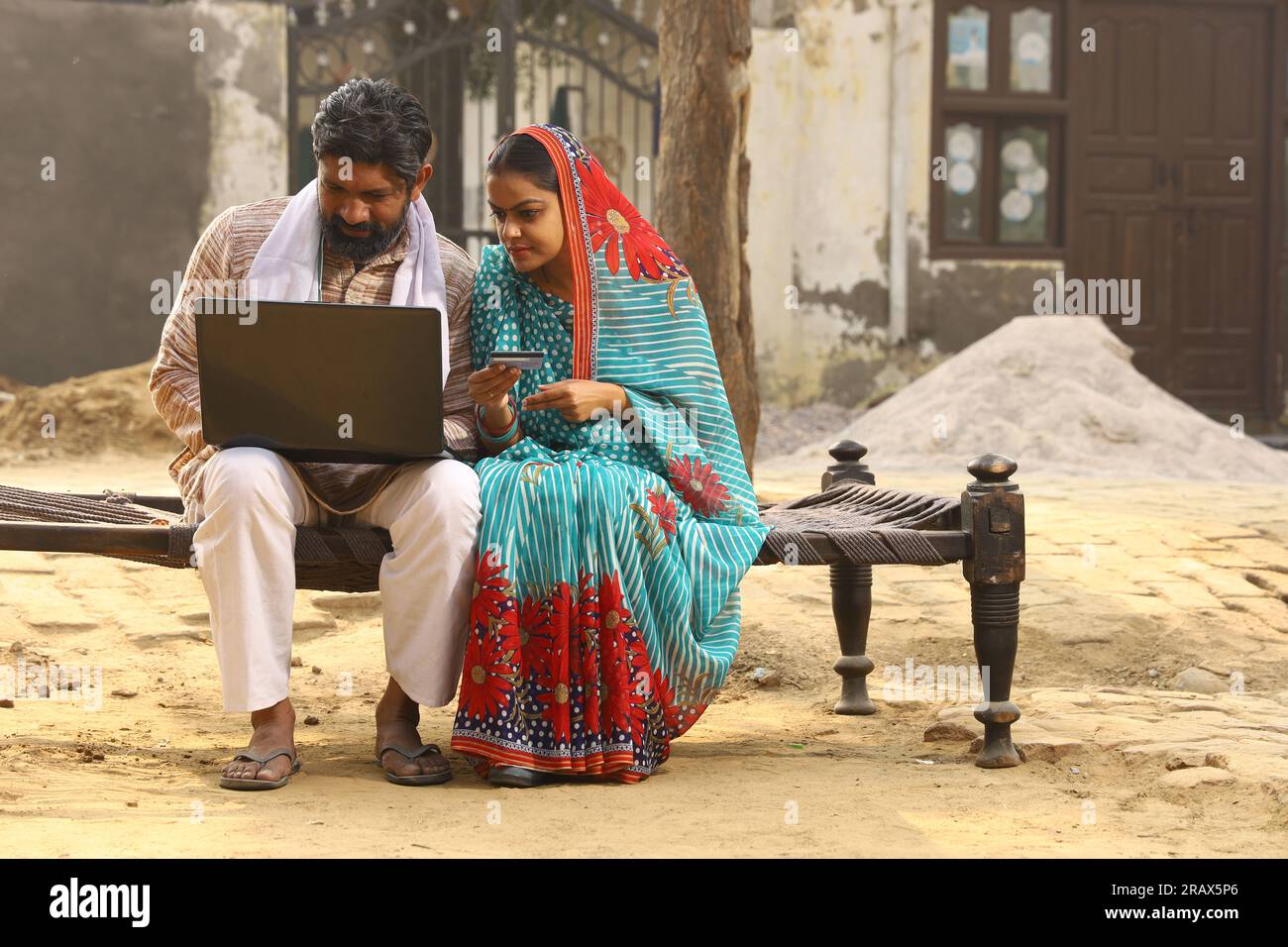 Happy Indian Rural family in village. Rural couple sitting together ...