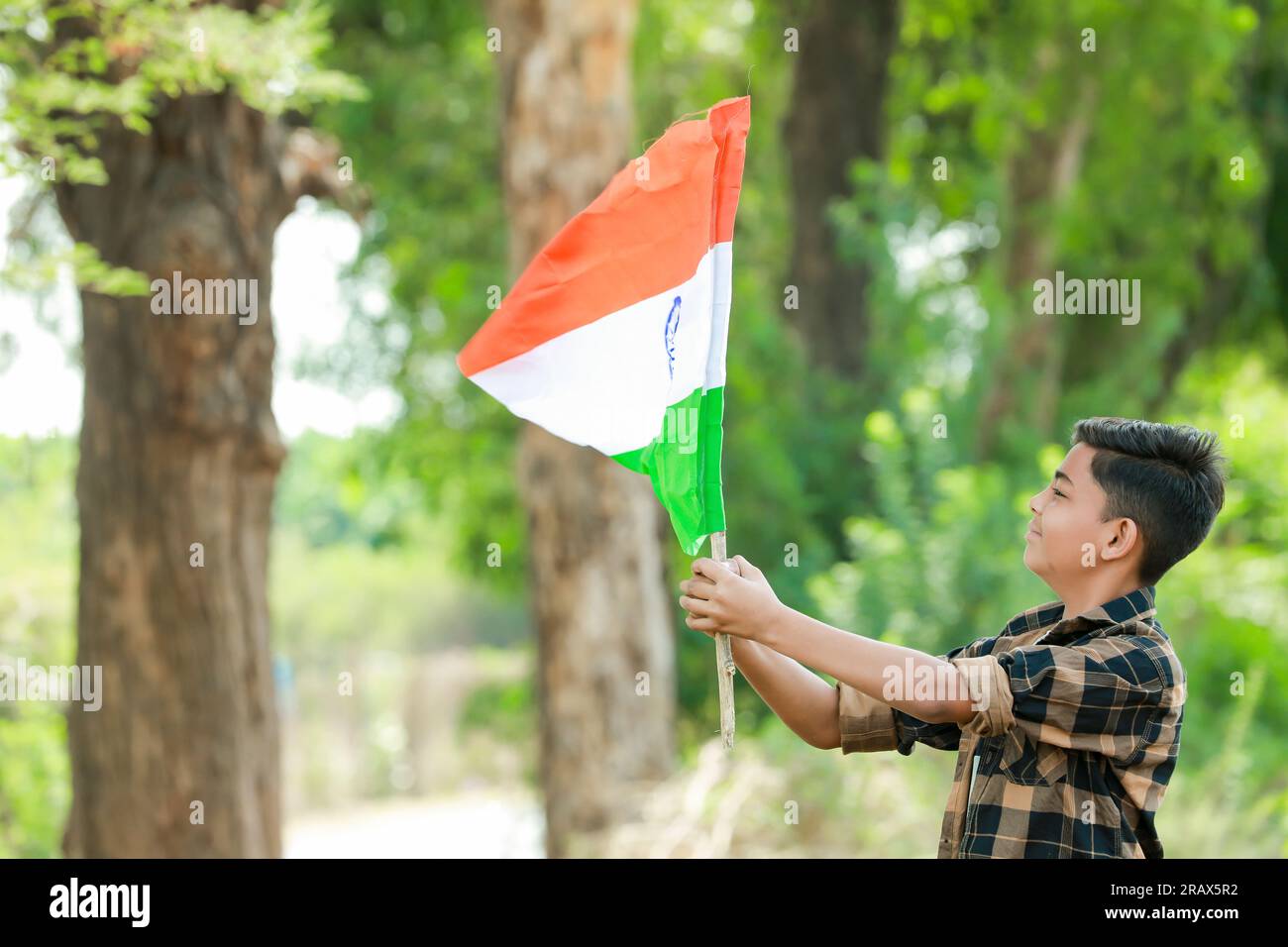 Indian boy holding national flag in farm, happy boy, national flag ...