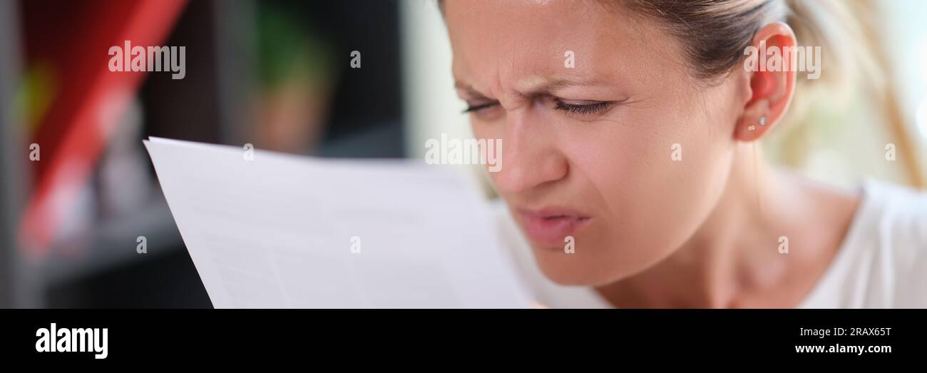 Mature woman squinting to read hi-res stock photography and images - Alamy