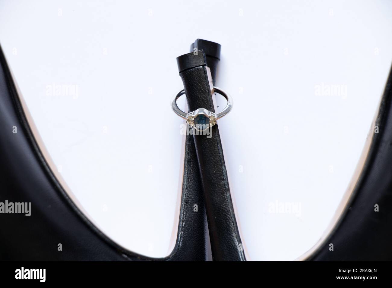 black leather womens shoes and high heels and they have a white gold ...