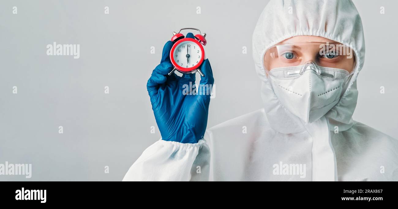 Timely diagnosis virus woman doctor alarm clock Stock Photo - Alamy