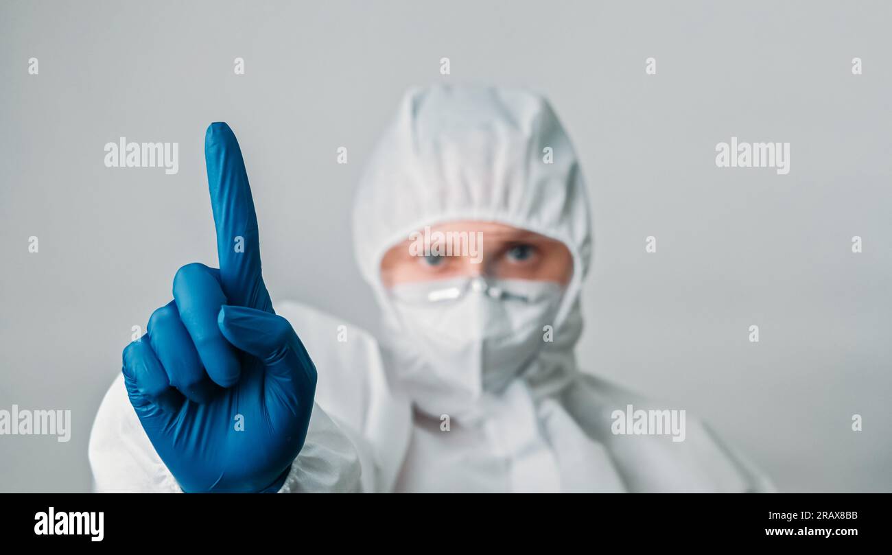 Doctor warning healthcare woman gloves hand sign Stock Photo - Alamy