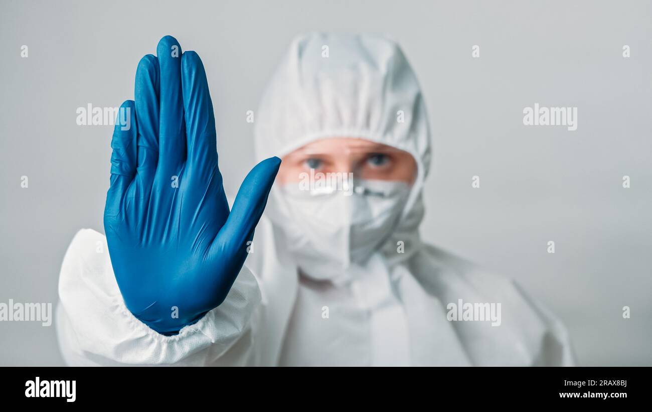 Stop disease protection doctor woman hand gesture Stock Photo - Alamy