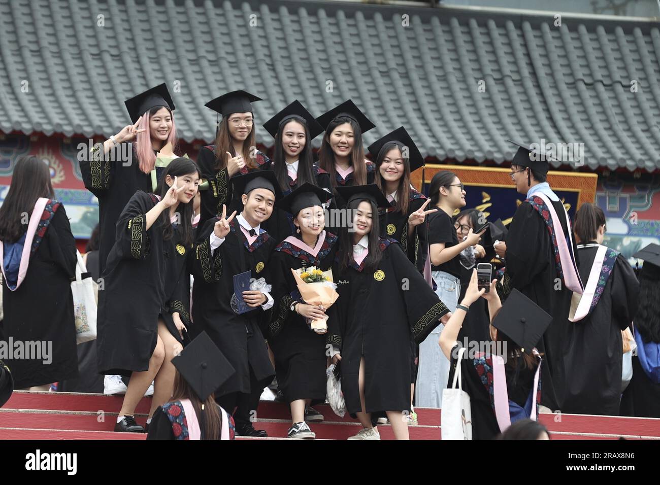 **CHINESE MAINLAND, HONG KONG, MACAU AND TAIWAN OUT** Graduates attend ...