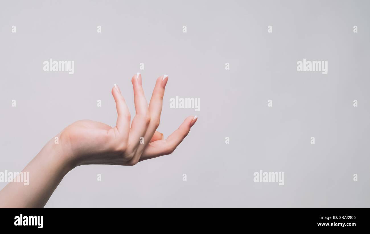Give me outstretching gesture woman hand demanding Stock Photo - Alamy